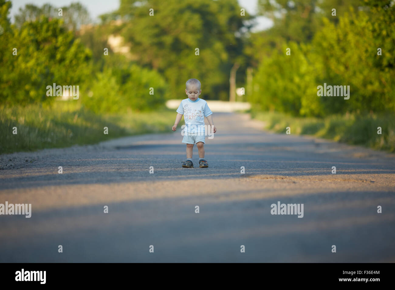 boy run on the road Stock Photo - Alamy