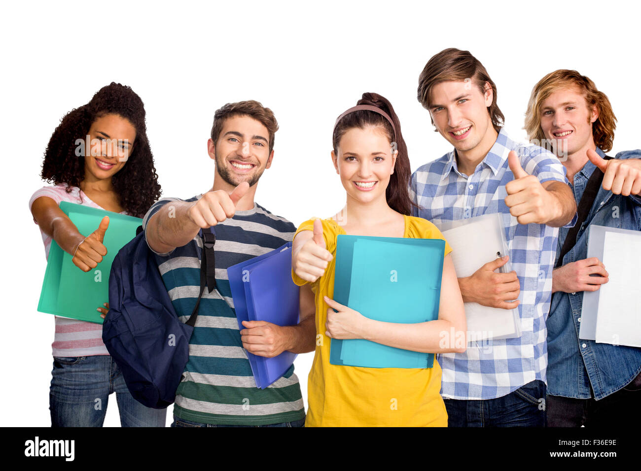 Happy students gesturing thumbs up hi-res stock photography and images ...