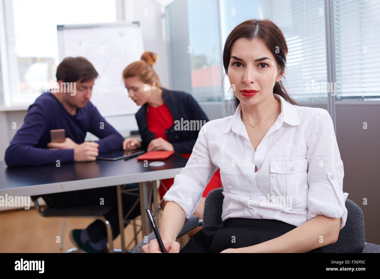 Three businessmen working in the office Stock Photo - Alamy