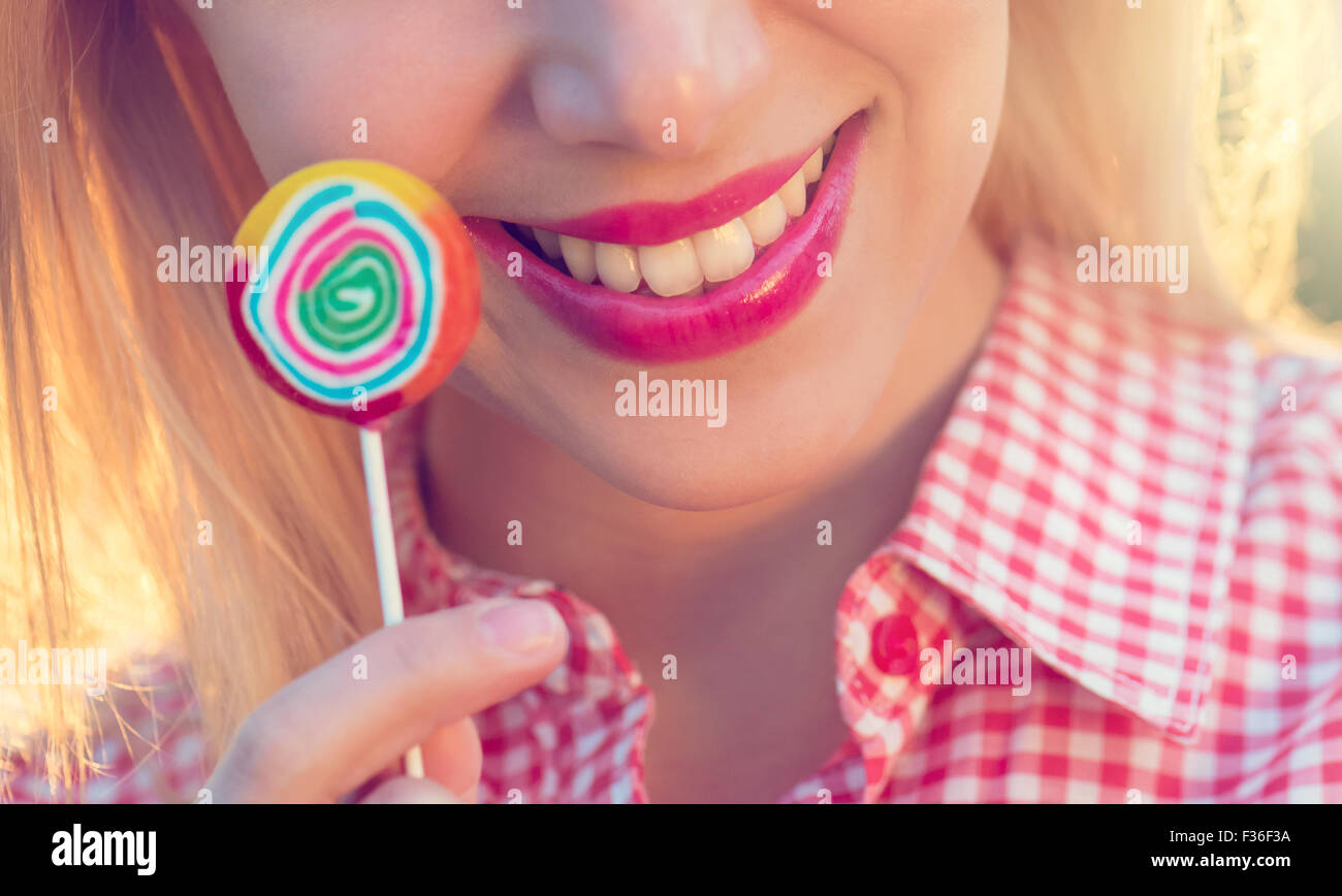 Beautiful woman with lollipop Stock Photo - Alamy