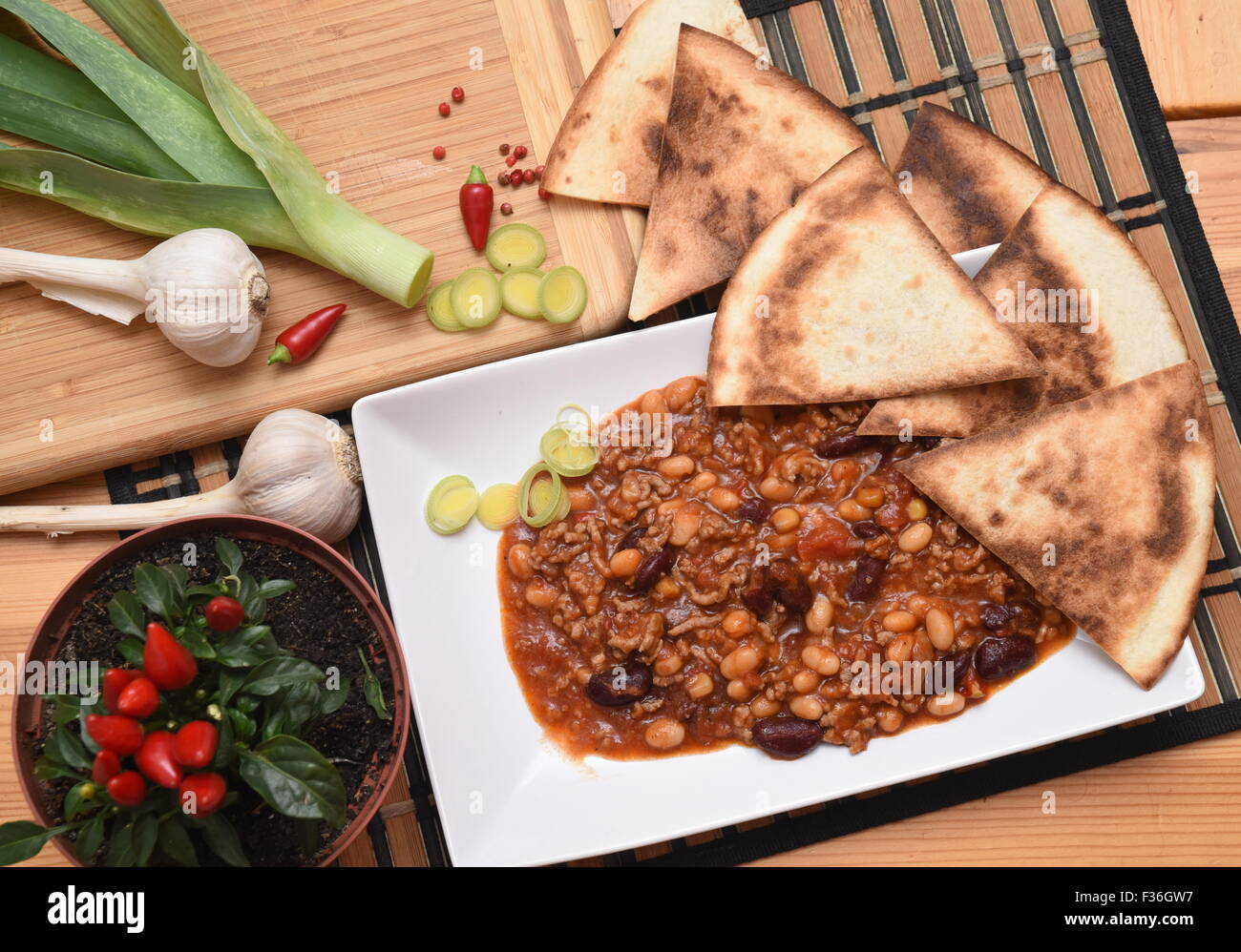 Chilli con carne with pepper, garlicsr and tortillas Stock Photo - Alamy