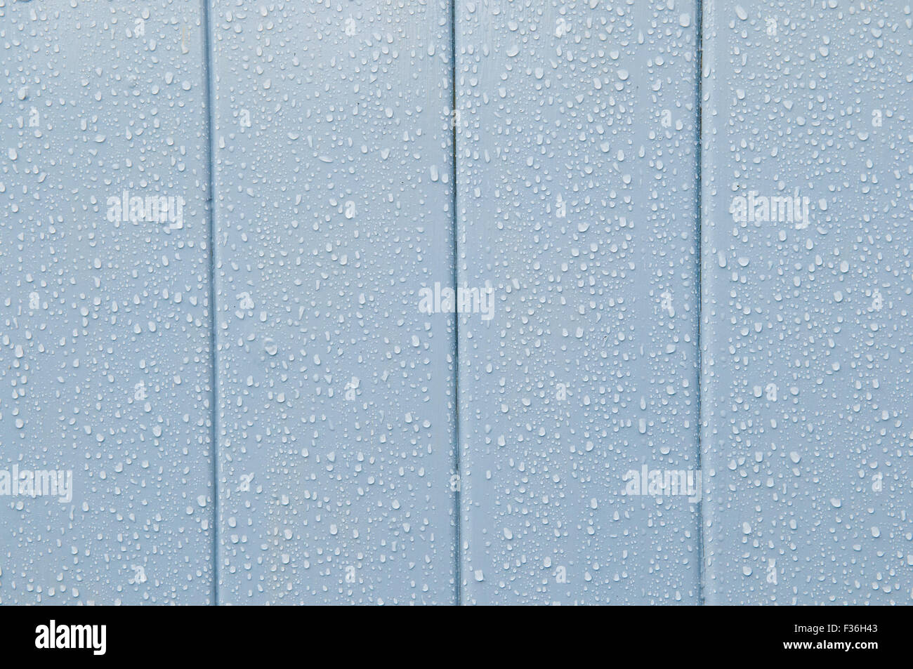 Water droplets on a smooth striped blue surface Stock Photo - Alamy