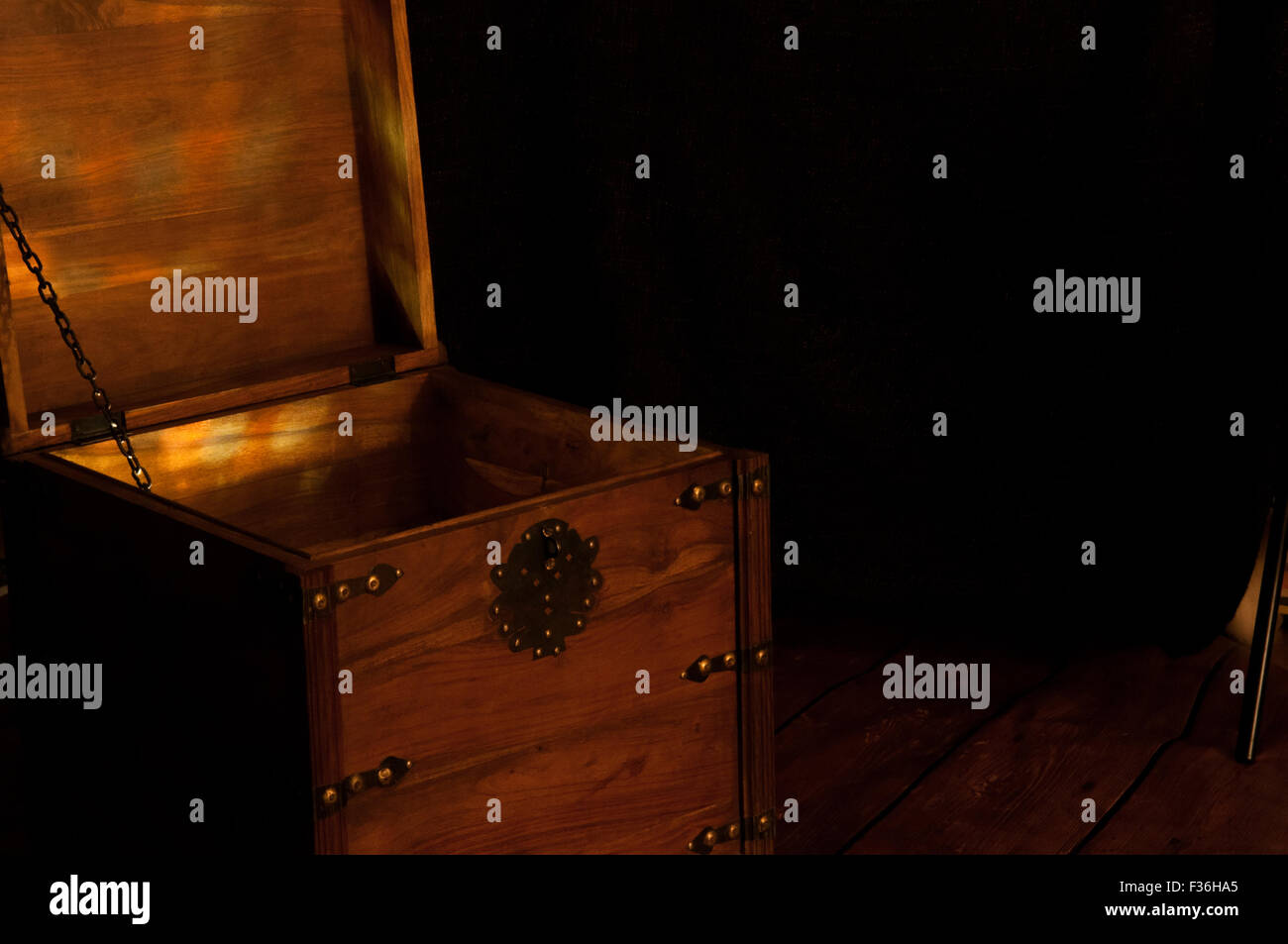 open treasure chest with a glowing light inside Stock Photo - Alamy