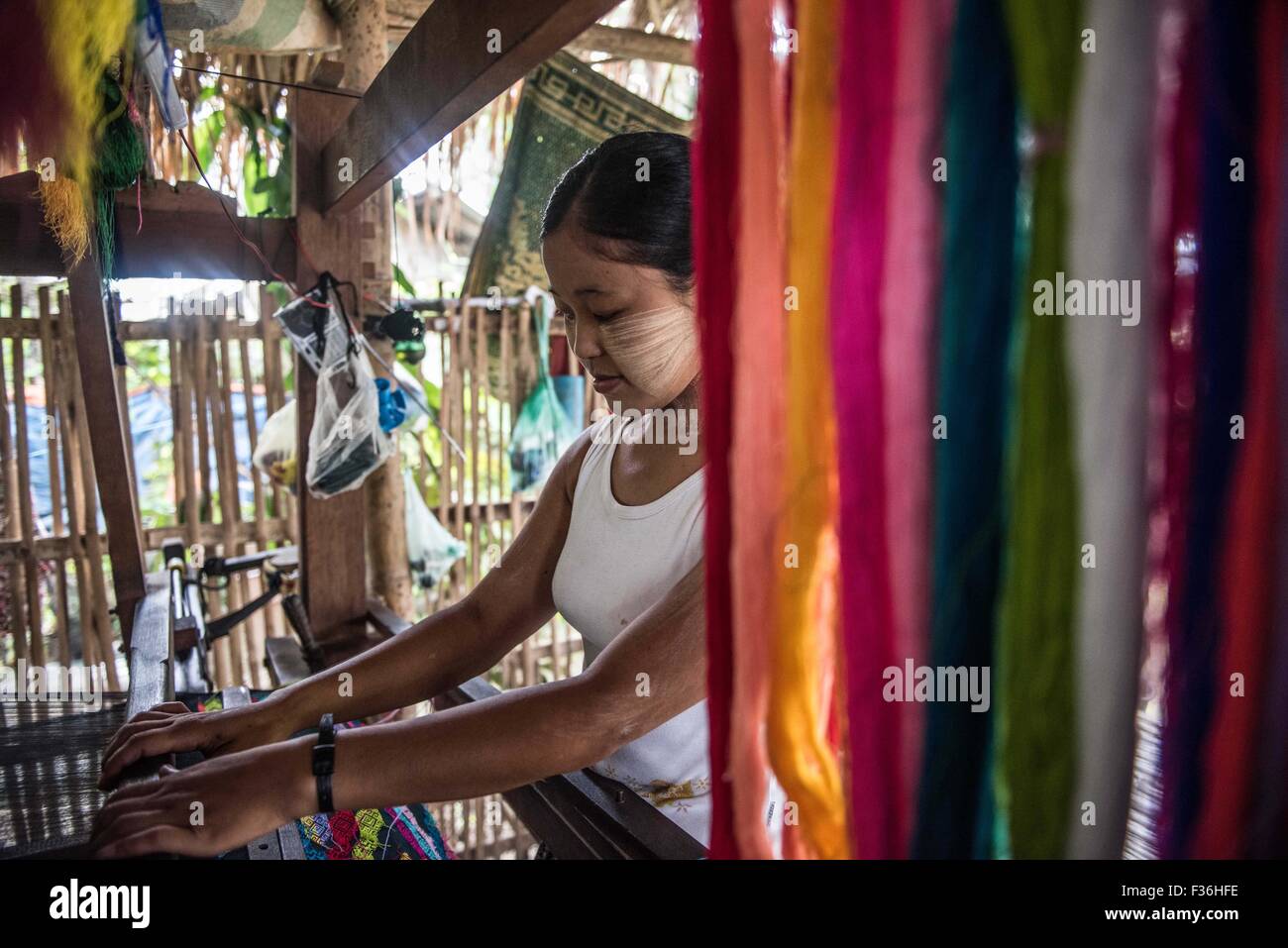 A woman works at a loom in Kachin State, Myanmar Stock Photo - Alamy