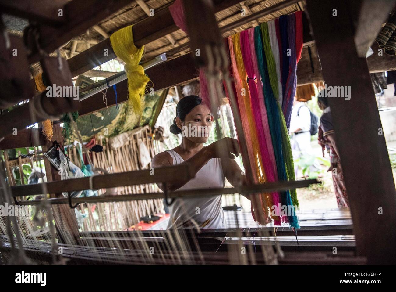 A woman works at a loom in Kachin State, Myanmar Stock Photo - Alamy