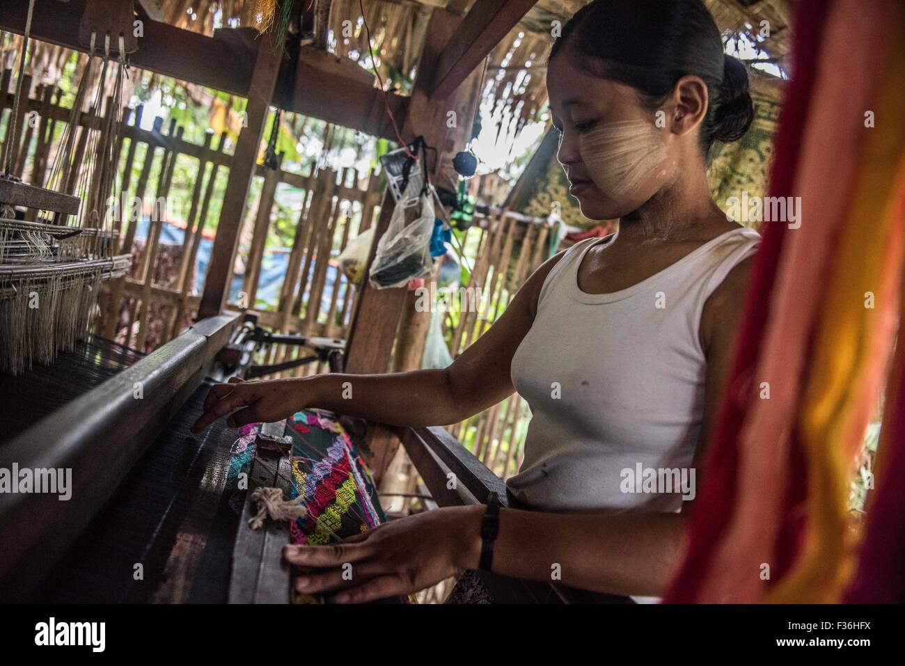 A woman works at a loom in Kachin State, Myanmar Stock Photo - Alamy