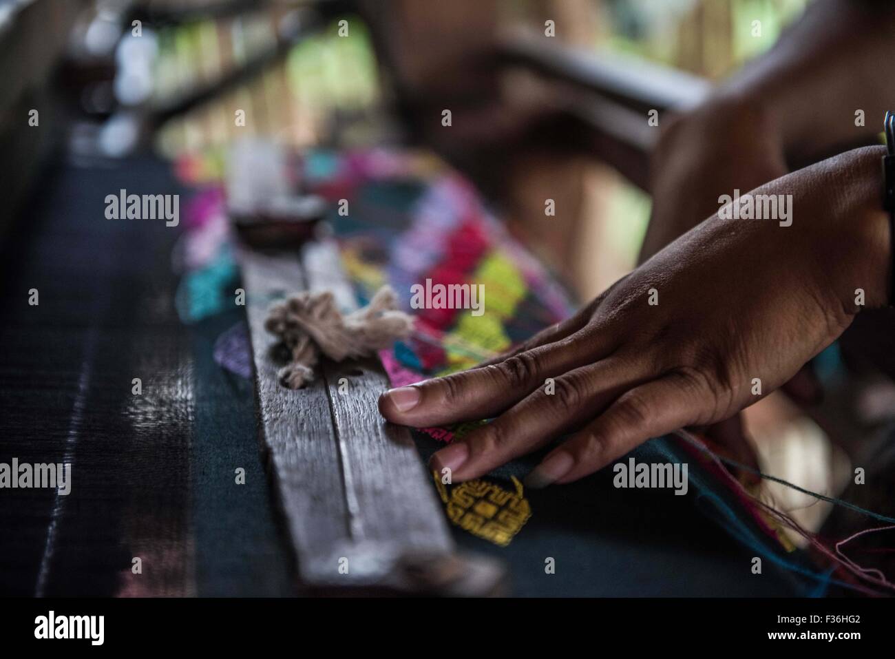 A woman works at a loom in Kachin State, Myanmar Stock Photo - Alamy