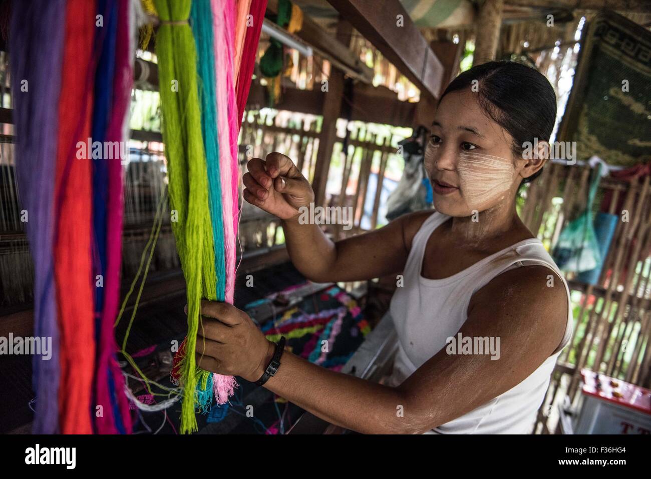 A woman works at a loom in Kachin State, Myanmar Stock Photo - Alamy