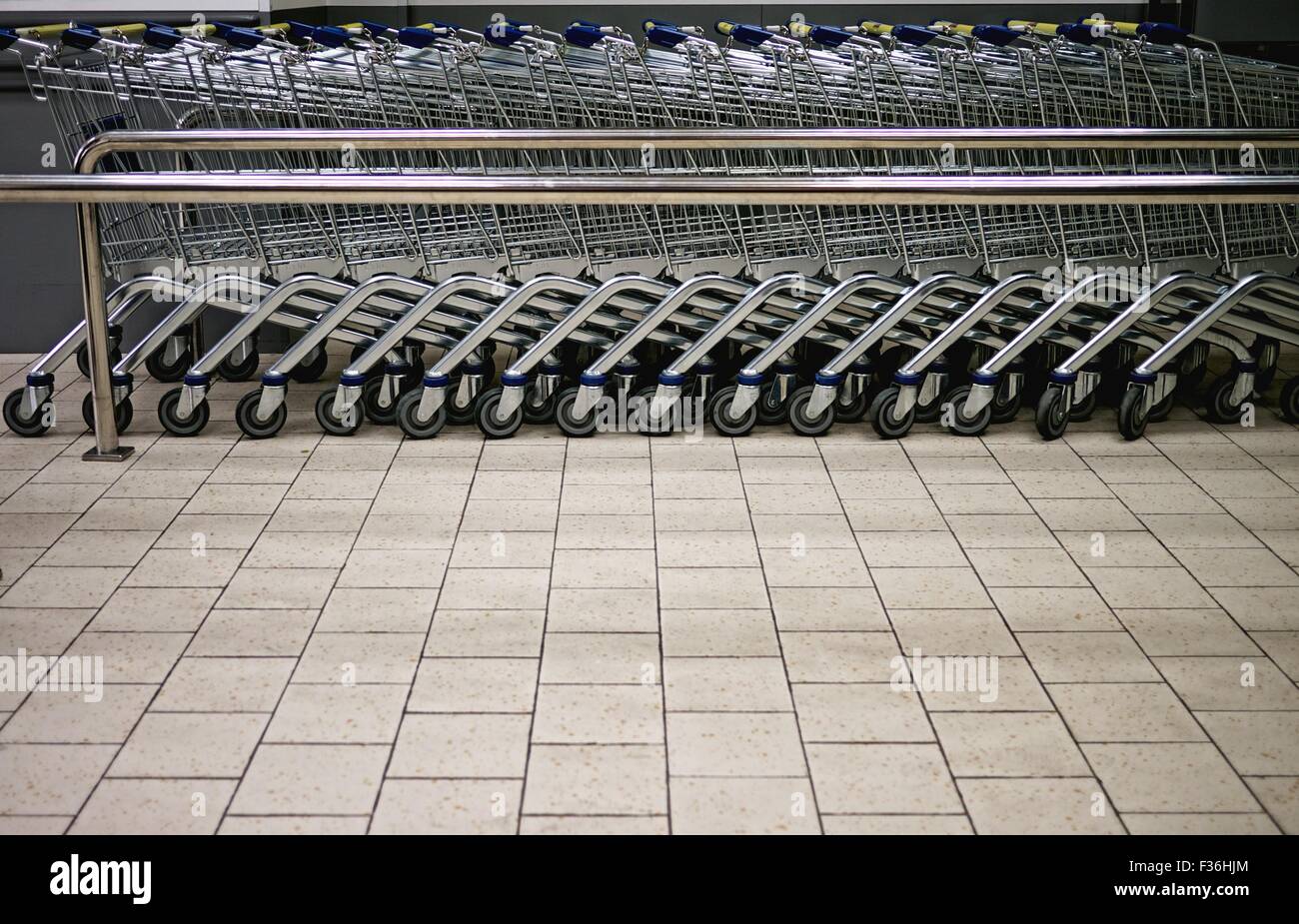 Empty shopping trolleys in a market Stock Photo - Alamy