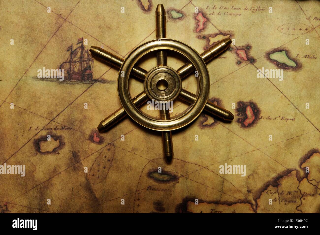 Sea wheel on the old map Stock Photo - Alamy