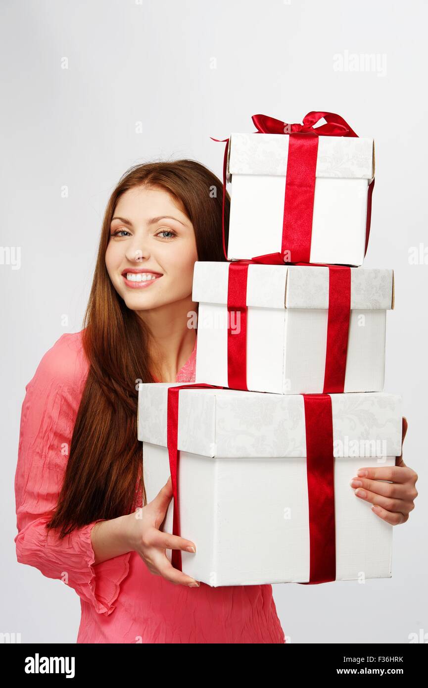 Beautiful brunette woman with a gift boxes Stock Photo - Alamy