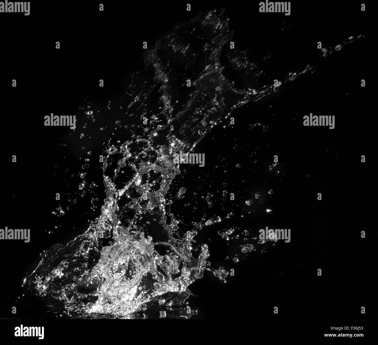 Water splash isolated on black background Stock Photo - Alamy