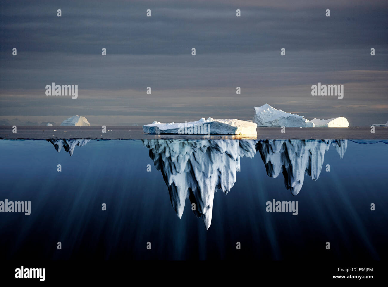 Above and below water view of icebergs in the Antarctica showing the ...