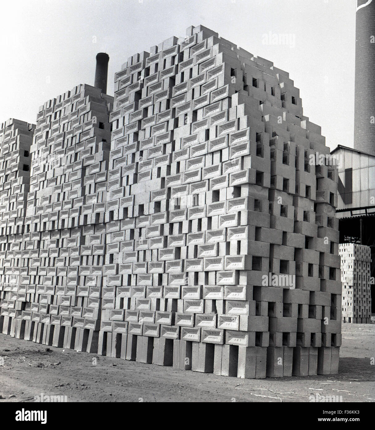 Historical, 1950s, finished bricks stacked on top of each other outside ...