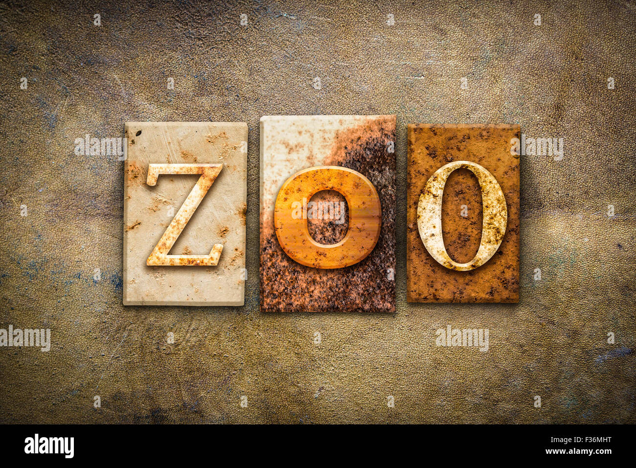 The word "ZOO" written in rusty metal letterpress type on an old aged ...