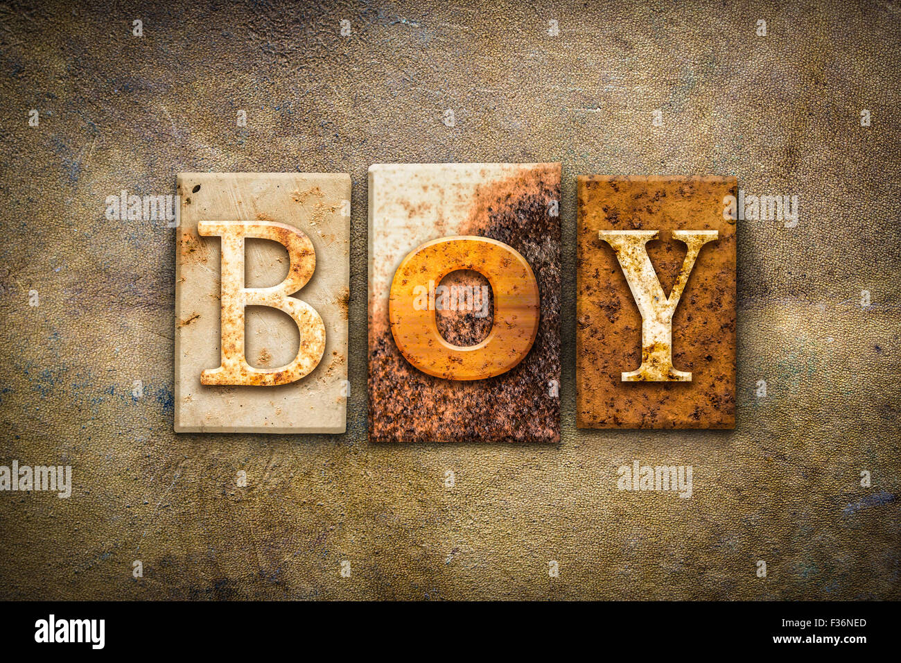 The word "BOY" written in rusty metal letterpress type on an old aged ...