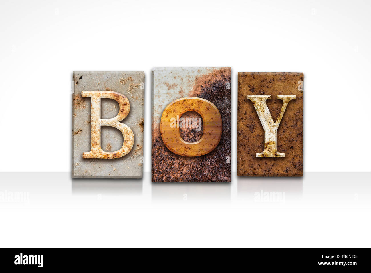 The word "BOY" written in rusty metal letterpress type isolated on a ...