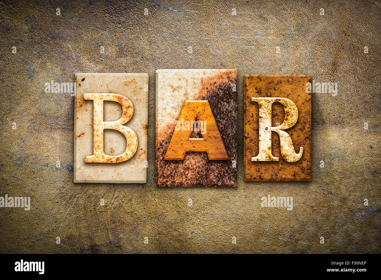 The word "BAR" written in rusty metal letterpress type on an old aged ...