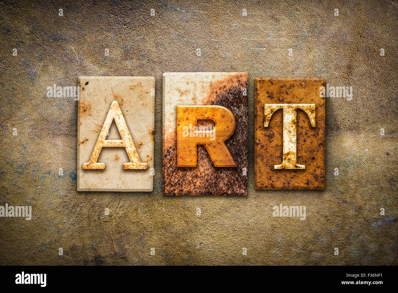 The word "ART" written in rusty metal letterpress type on an old aged ...