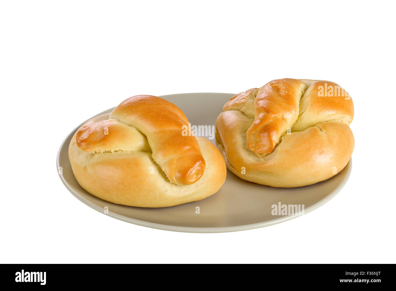 Bread roll on ceramic plate, isolated on white background Stock Photo ...