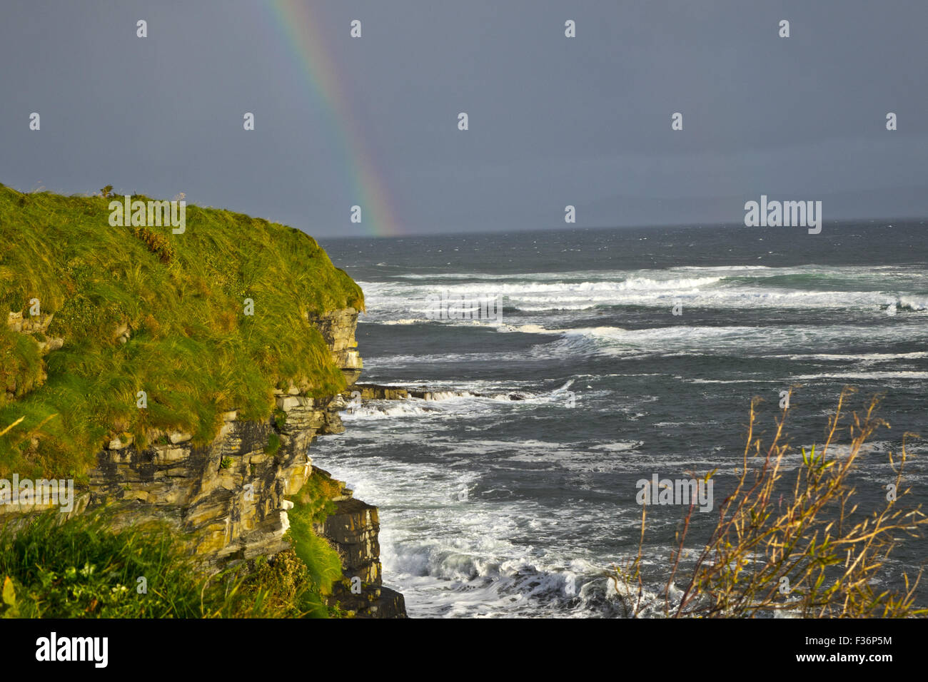 rainbow over Atlantic sea waves Stock Photo - Alamy