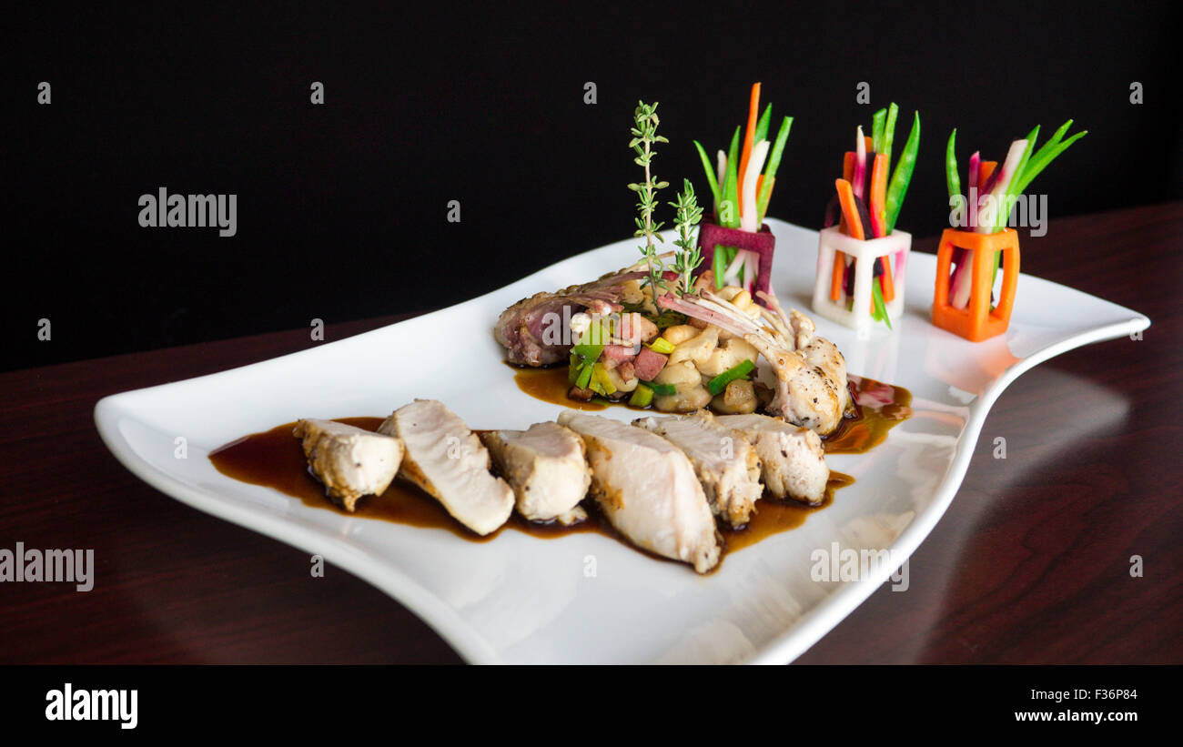 Sauteed rabbit loin and chops with bean medley and vegetables Stock ...