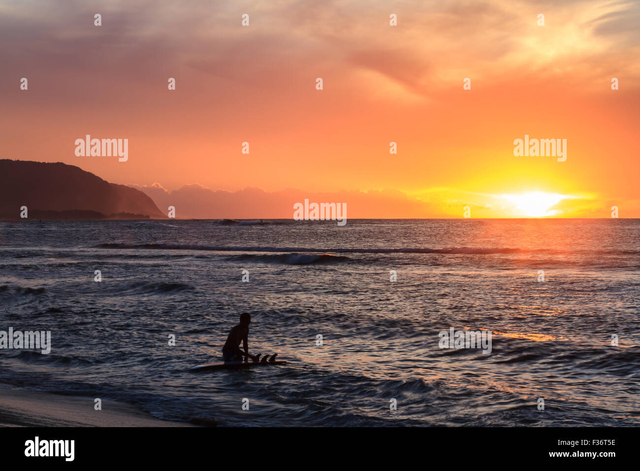 Sunset surf session, north shore of Oahu Stock Photo - Alamy