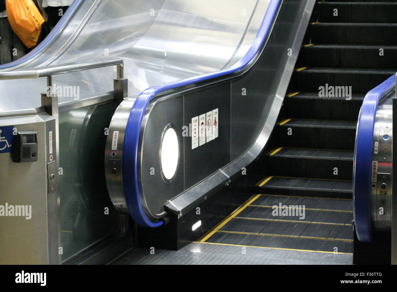 Blue rail escalator Stock Photo - Alamy