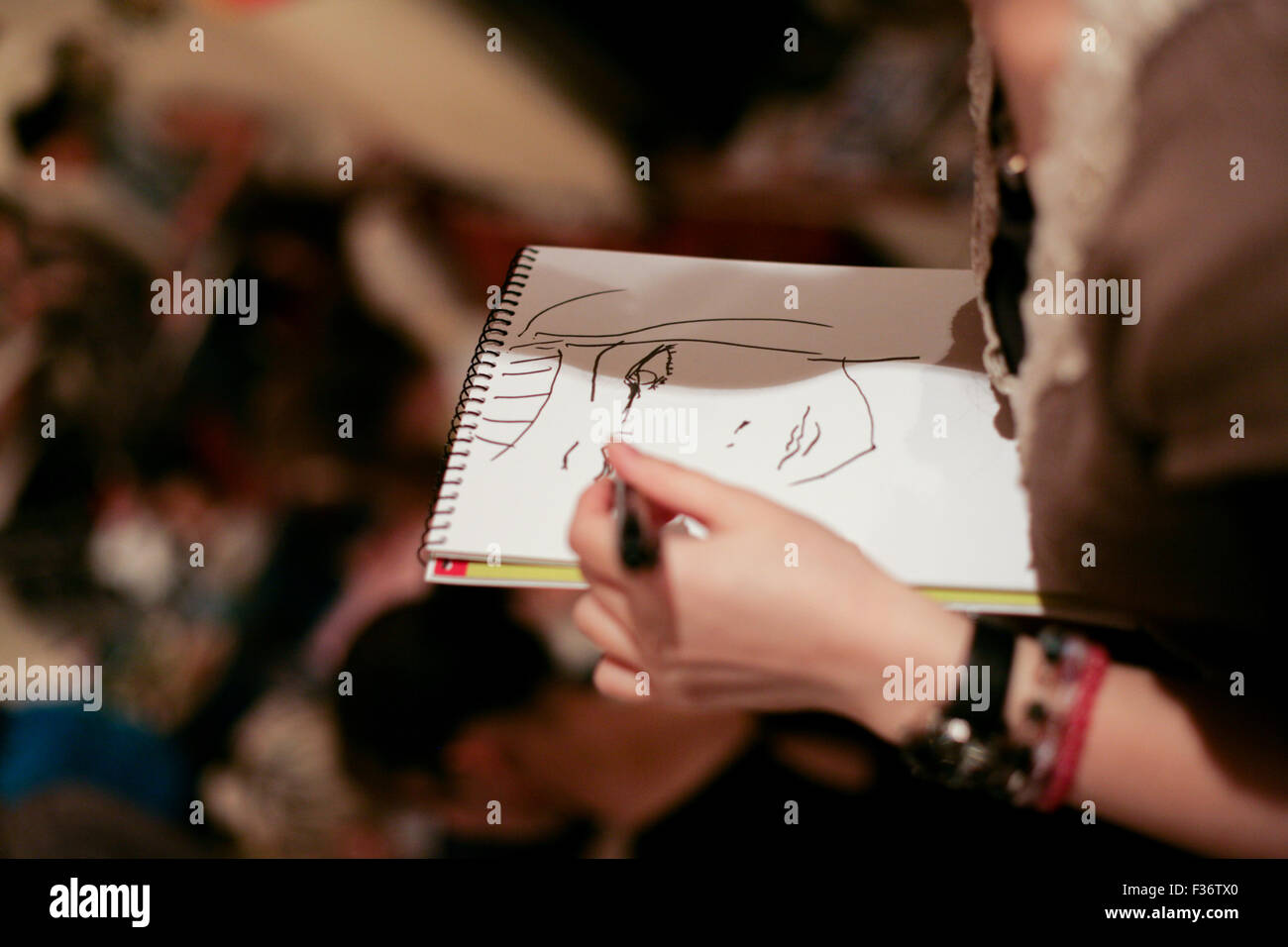 Artist illustrator drawing a picture with pen pencil Stock Photo - Alamy