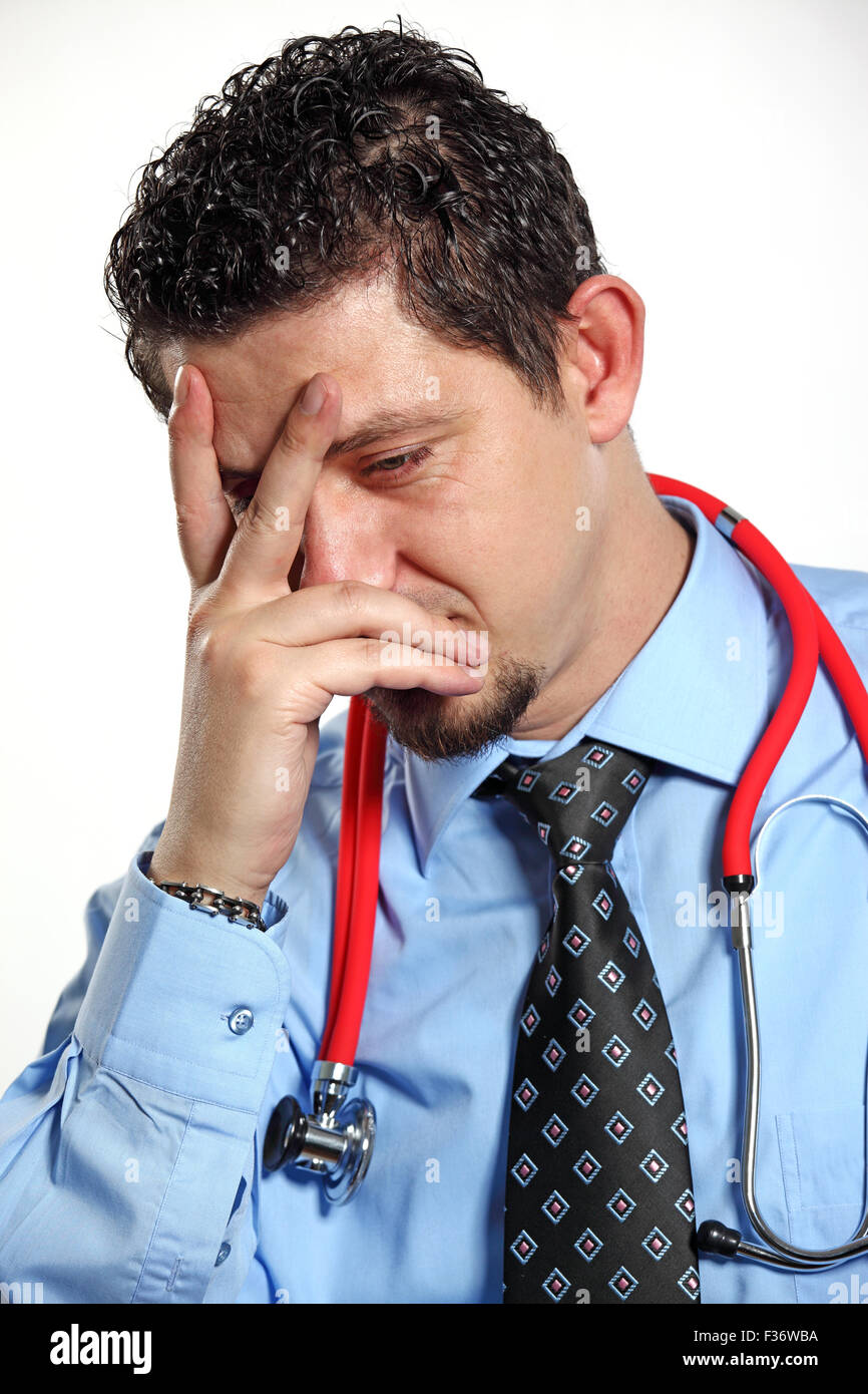 Sad and unhappy Doctor on the white background Stock Photo - Alamy