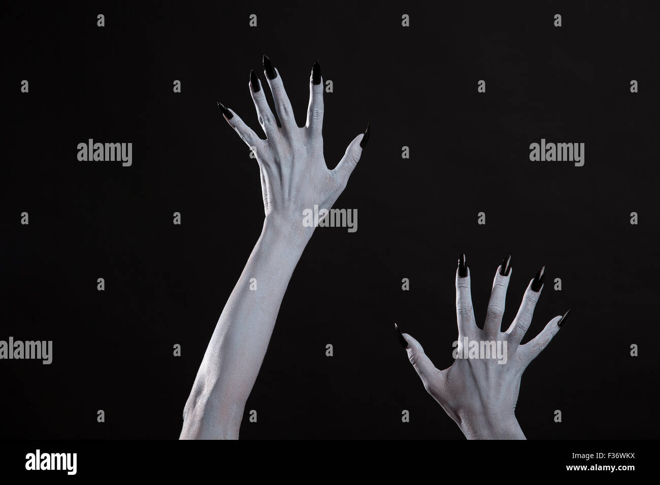 Pale ghost or witch hands with sharp black nails, Halloween theme Stock ...