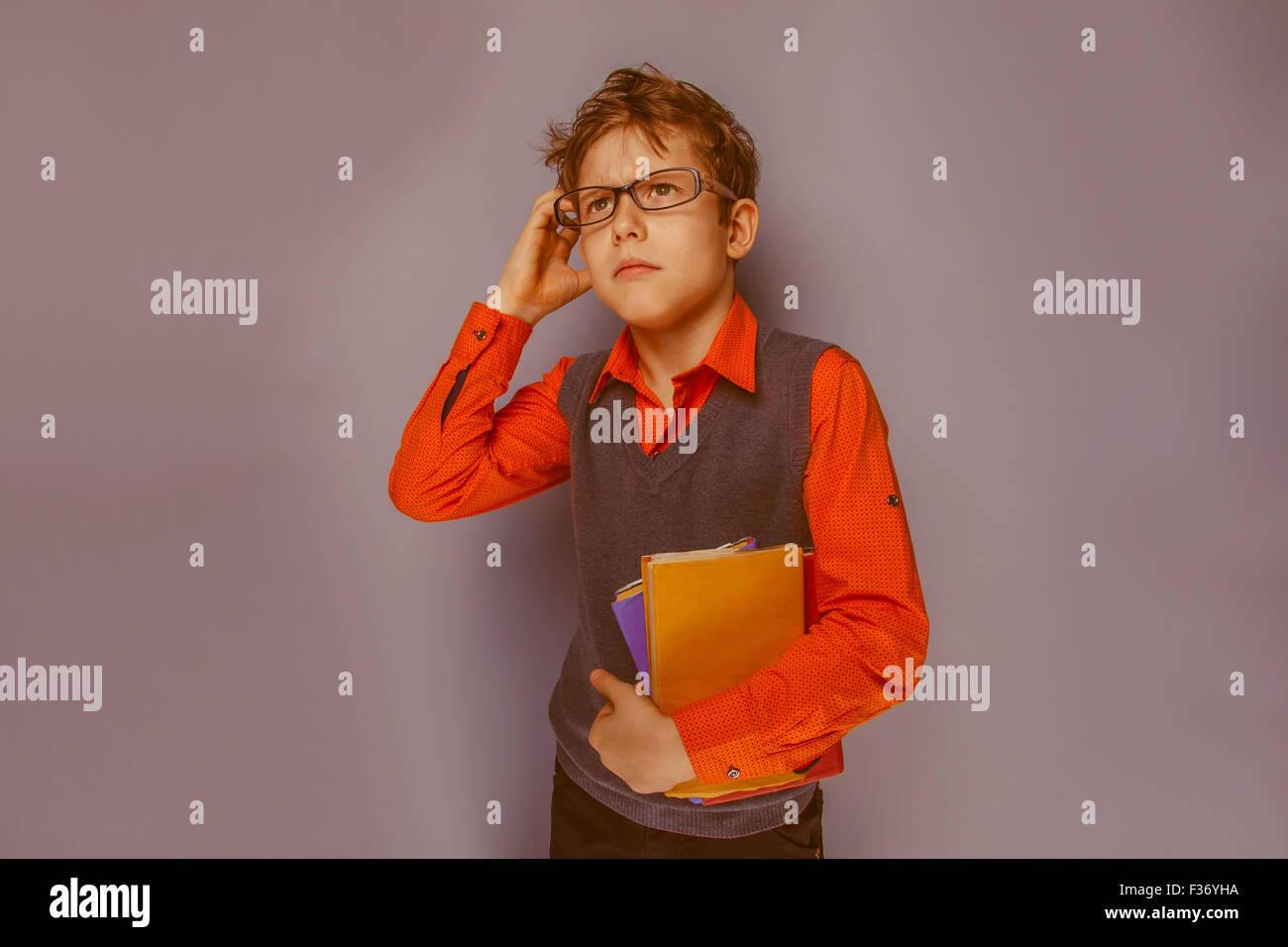 European-looking boy of ten years in glasses thinking intent Stock ...