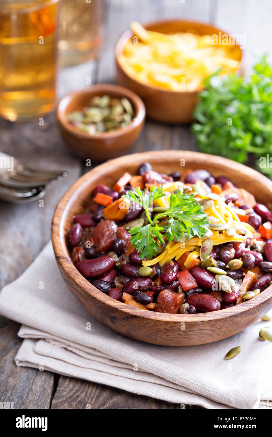Vegetarian chili with red and black beans, cheddar and pumpkin seeds ...
