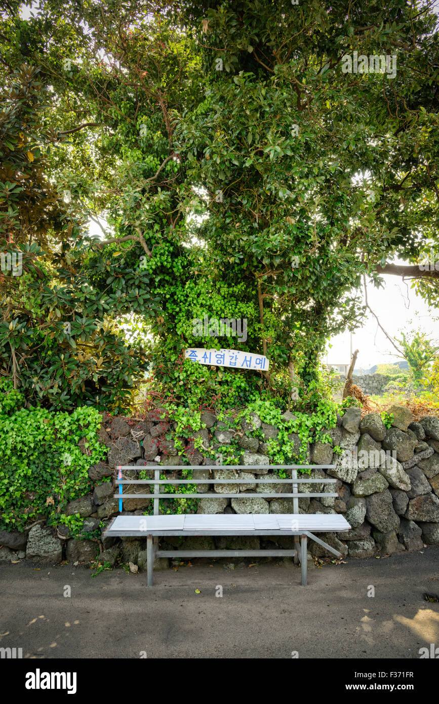 A bench in the Olle trail No. 2 in Jeju Island, Korea. The words above ...