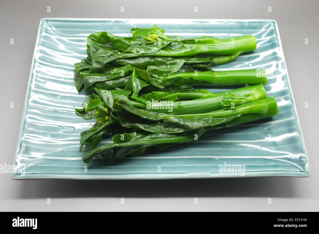 Cooked green Chinese kale Stock Photo - Alamy