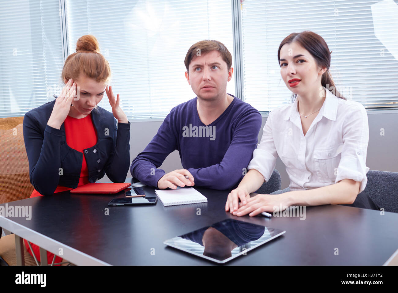 Three businessmen discussing something together Stock Photo - Alamy