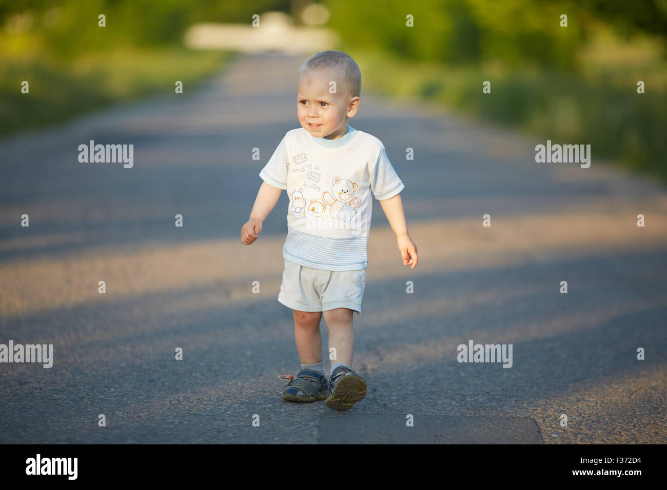 boy run on the road Stock Photo - Alamy