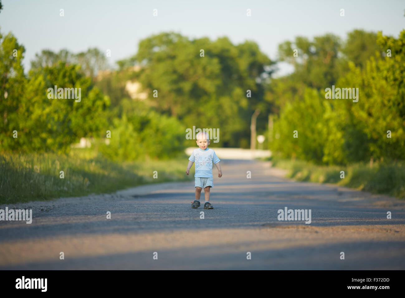 boy run on the road Stock Photo - Alamy