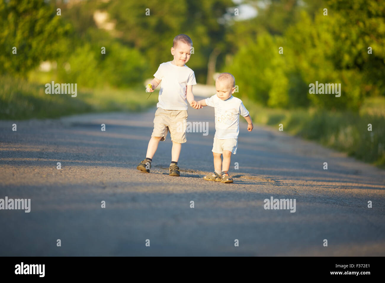 Two boys running forest hi-res stock photography and images - Alamy