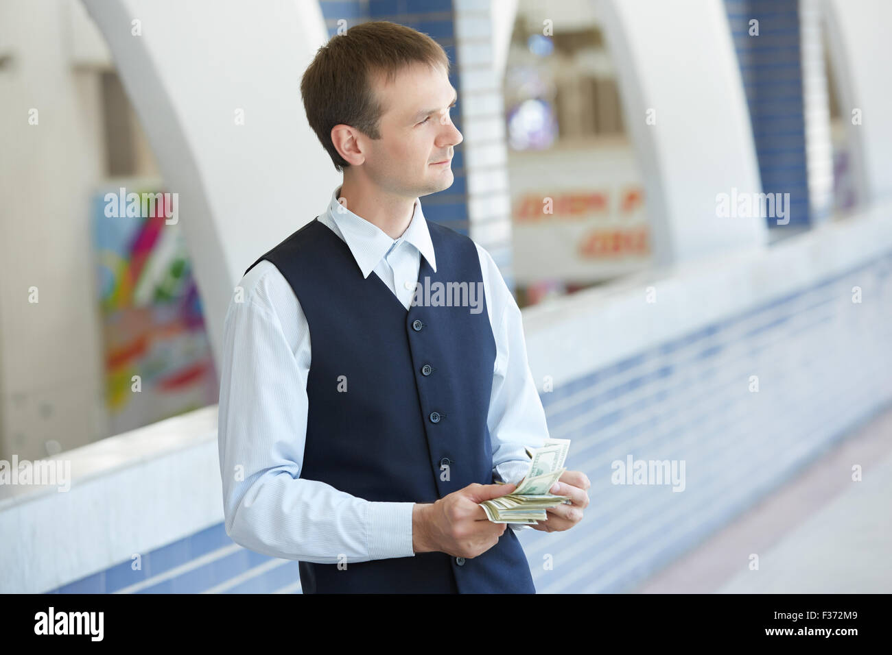 businessman holding money Stock Photo - Alamy