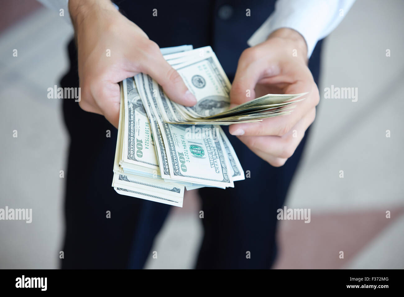 closeup money in male hands Stock Photo - Alamy