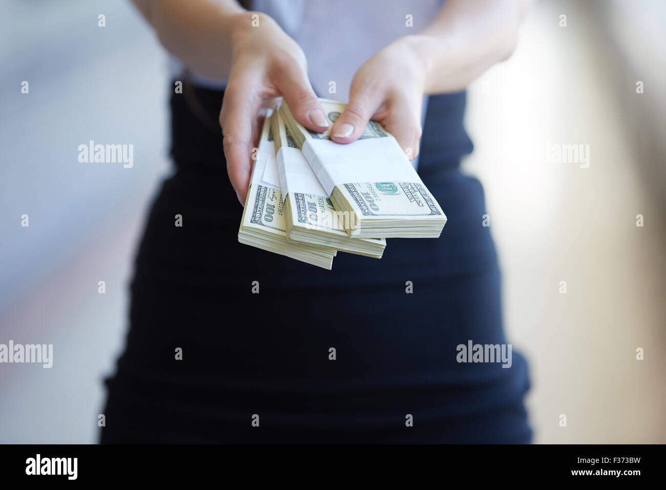 Money close-up in women's hands Stock Photo - Alamy
