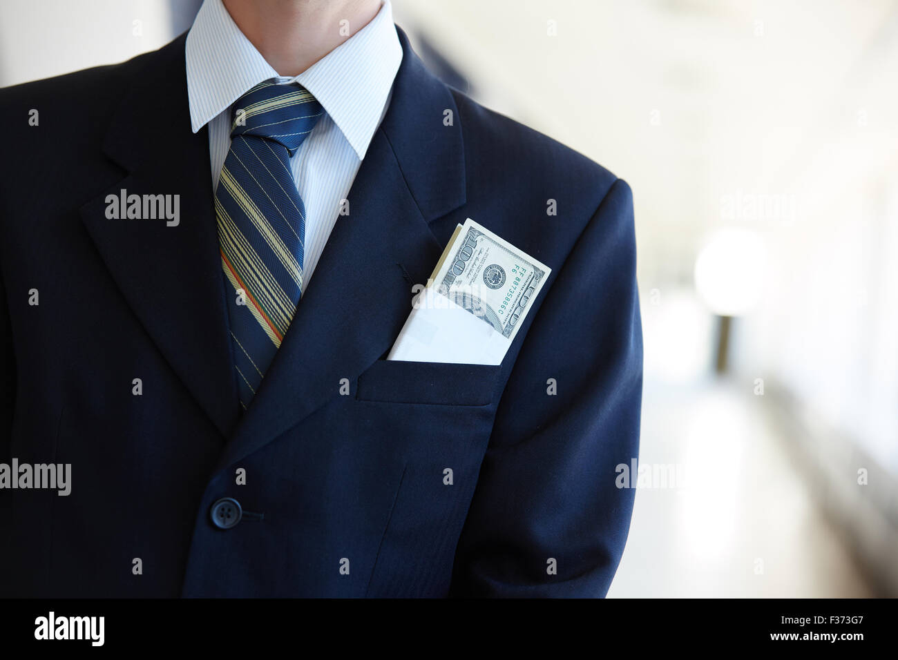 from his pocket a businessman sticking out of money Stock Photo - Alamy