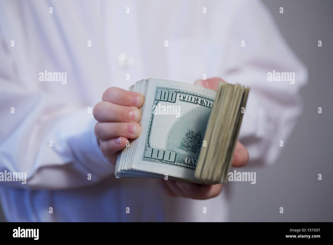 money in children's hands Stock Photo - Alamy