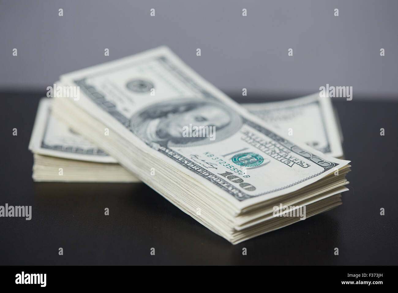 stacks of money Stock Photo - Alamy