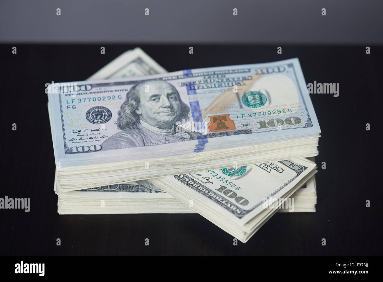 stacks of money Stock Photo - Alamy