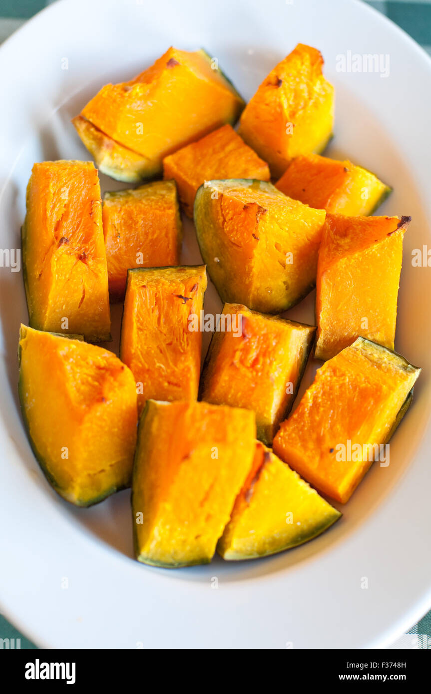 Plate pumpkin roasted in the oven and seasoned with olive oil and salt ...