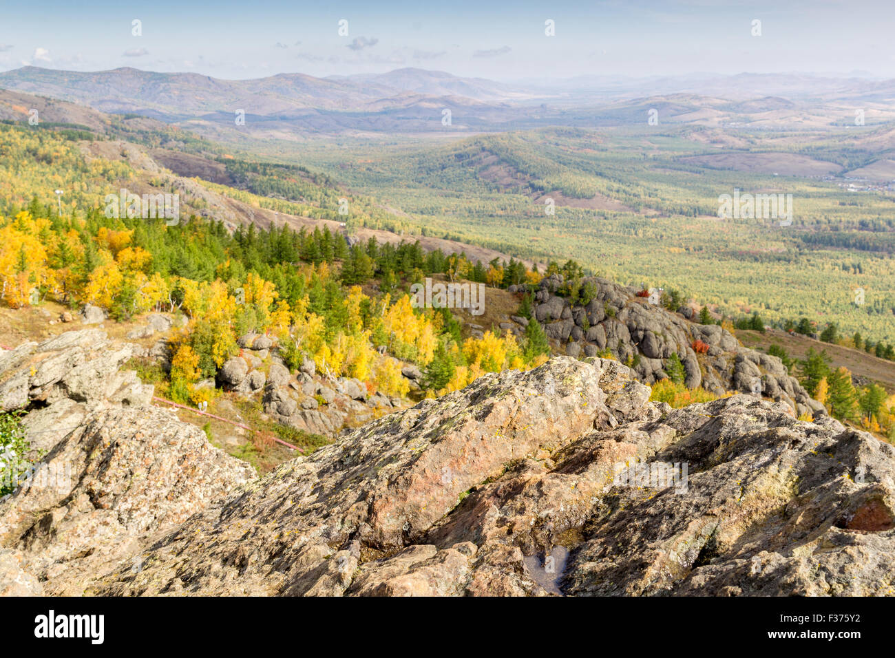 Large rocks and wild forests create a rugged landscape Stock Photo - Alamy