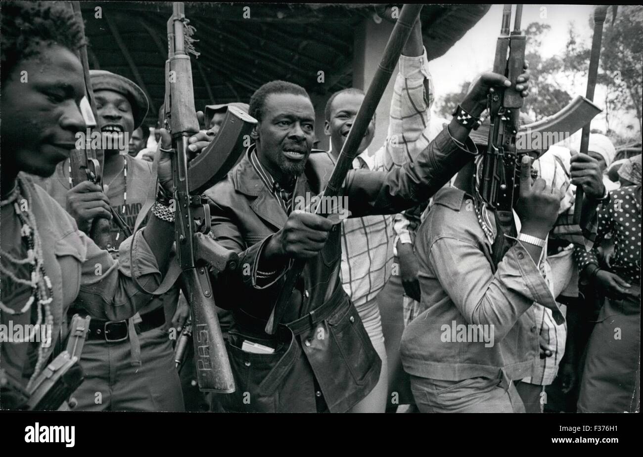 Dec. 16, 1974 - Rhodesia James Chikerema (centre) waving an AK-47 ...