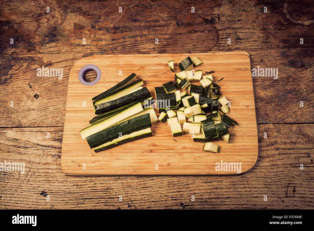 Diced and chopped courgette on a chopping board Stock Photo - Alamy